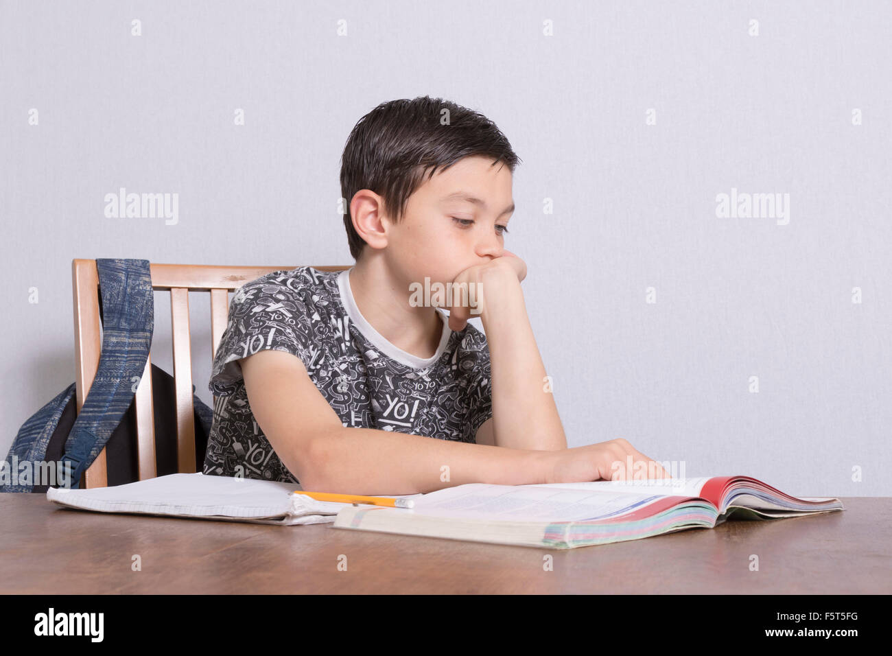 Pre-teen boy doing his homework Stock Photo - Alamy