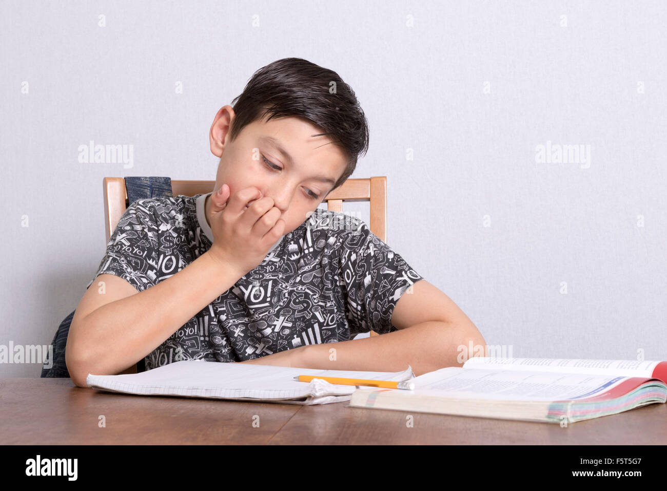 Pre-teen boy doing his homework Stock Photo - Alamy