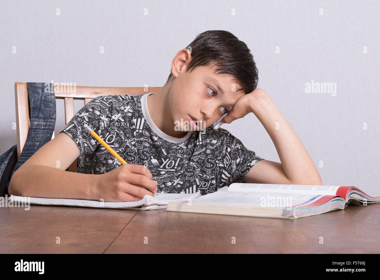 Pre-teen boy doing his homework Stock Photo - Alamy