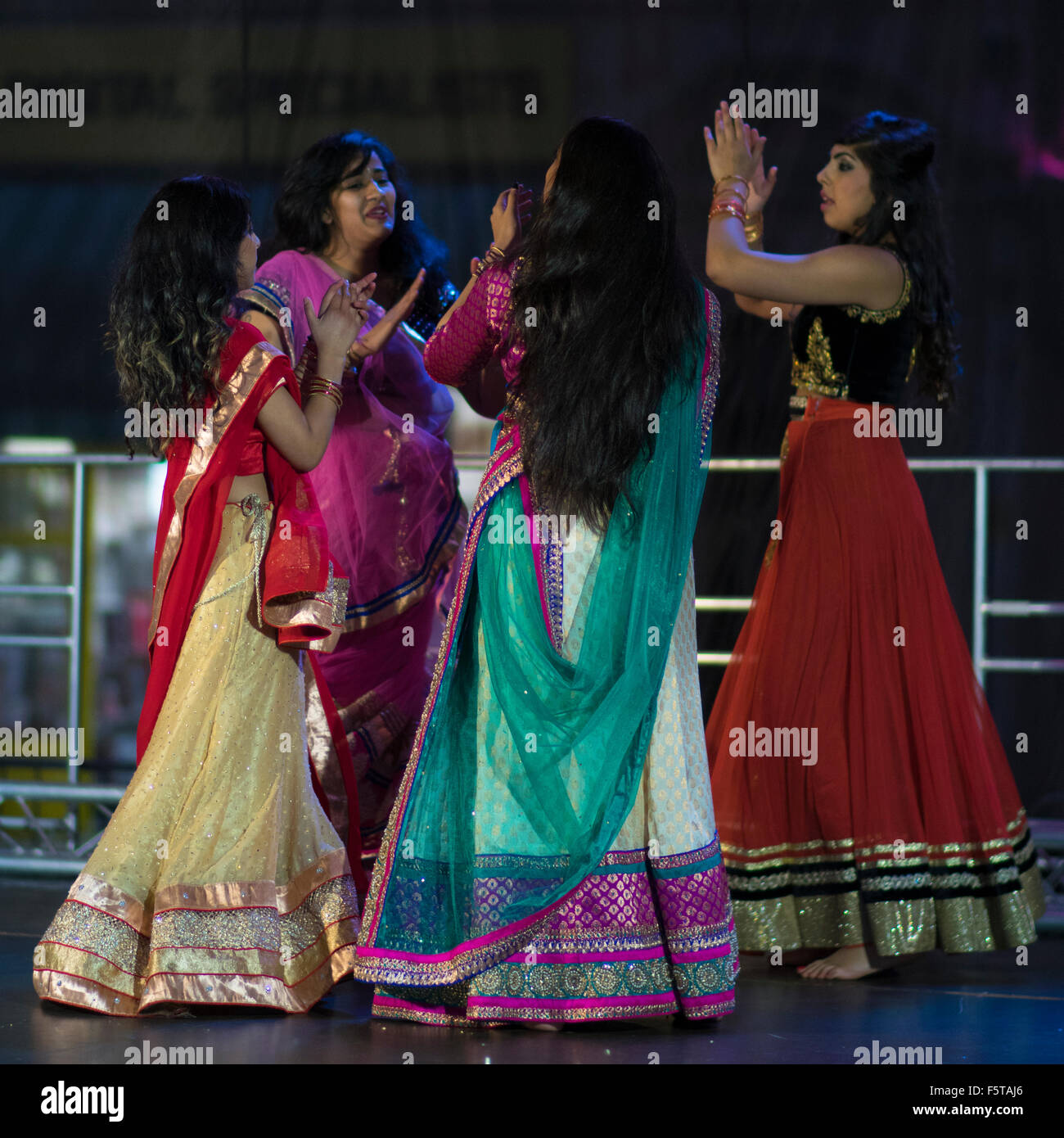 Indian dancers on stage wearing traditional costume Stock Photo - Alamy