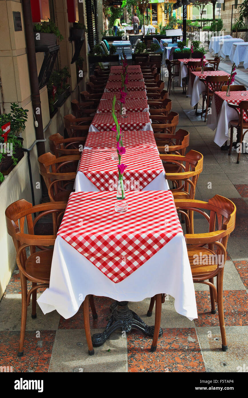 Restaurant tables in a row Stock Photo - Alamy