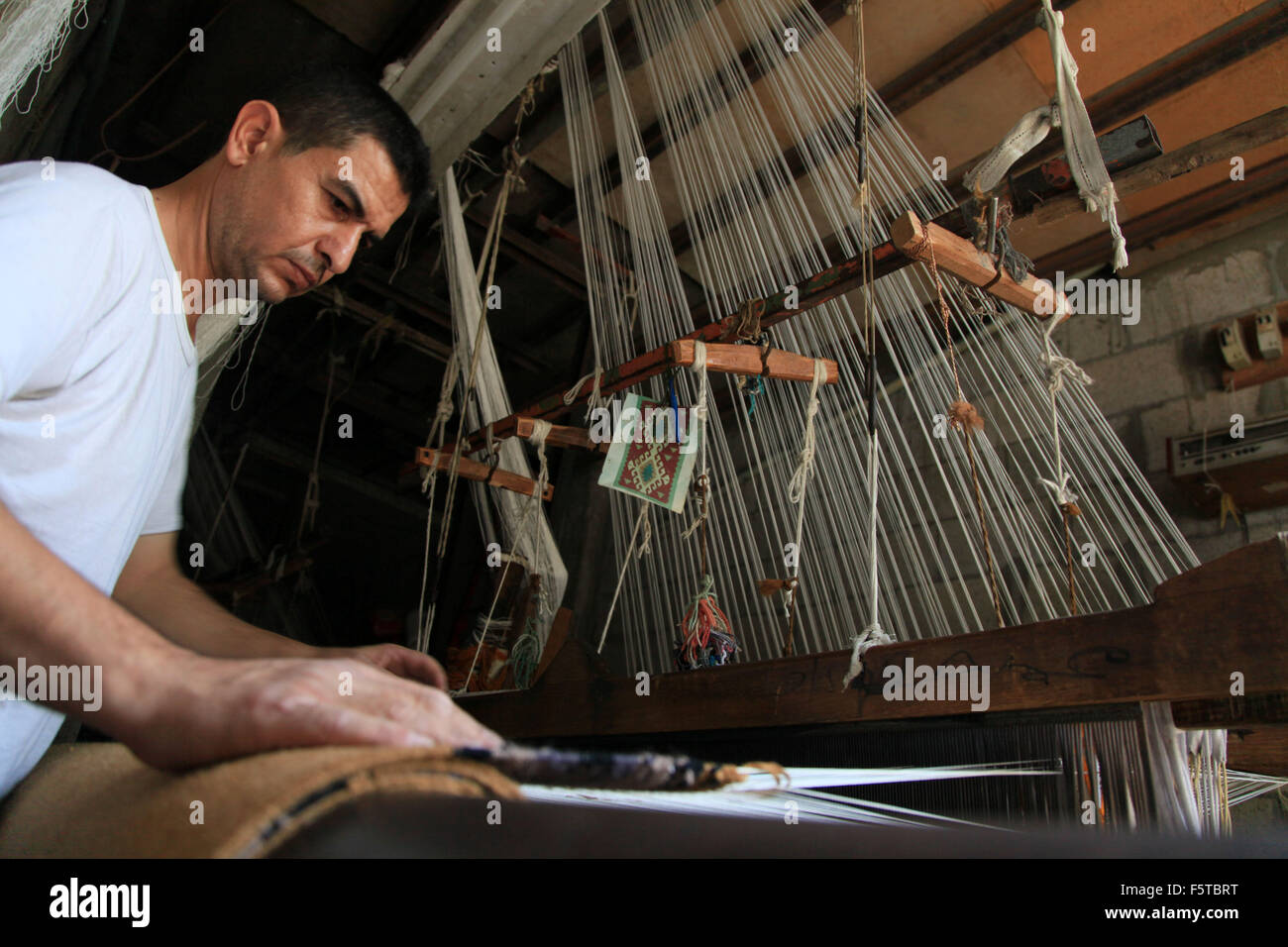 Palestine, Gaza. 07th Nov, 2015. A Palestinian man AL Sawaf works on ...