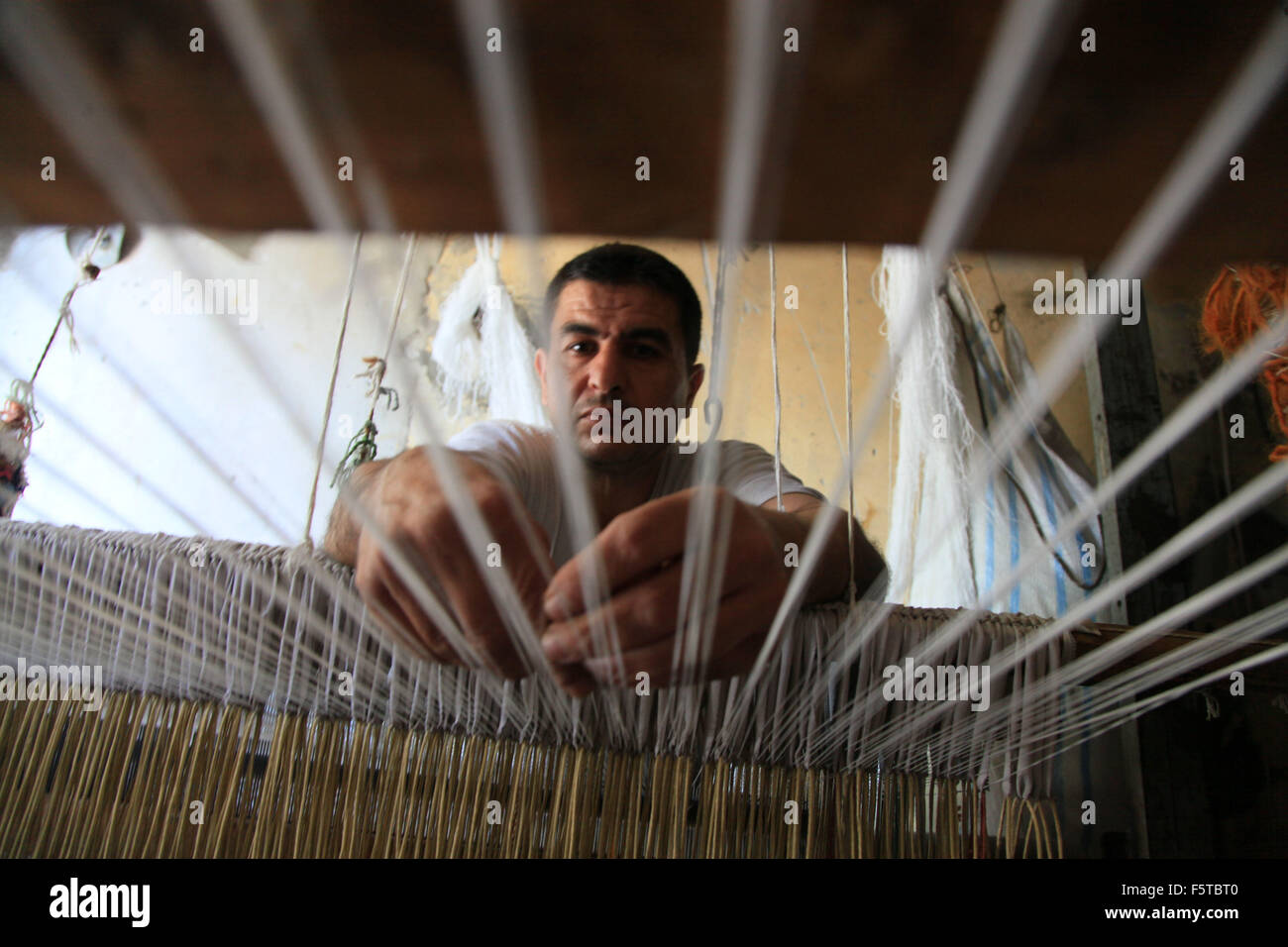 Palestine, Gaza. 07th Nov, 2015. A Palestinian man AL Sawaf works on ...