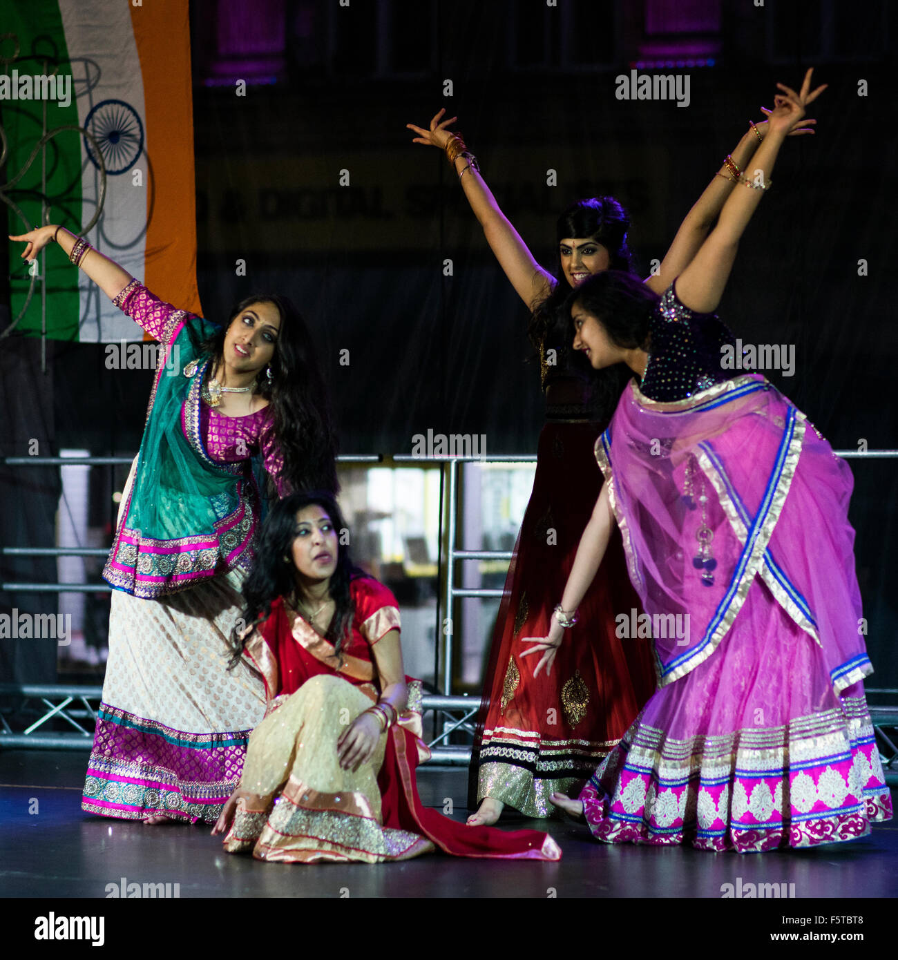 Indian dancers on stage wearing traditional costume Stock Photo - Alamy