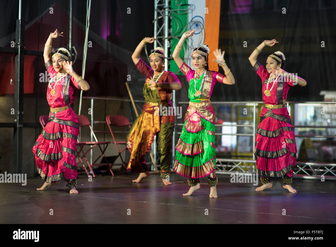 Indian dancers on stage wearing traditional costume Stock Photo - Alamy