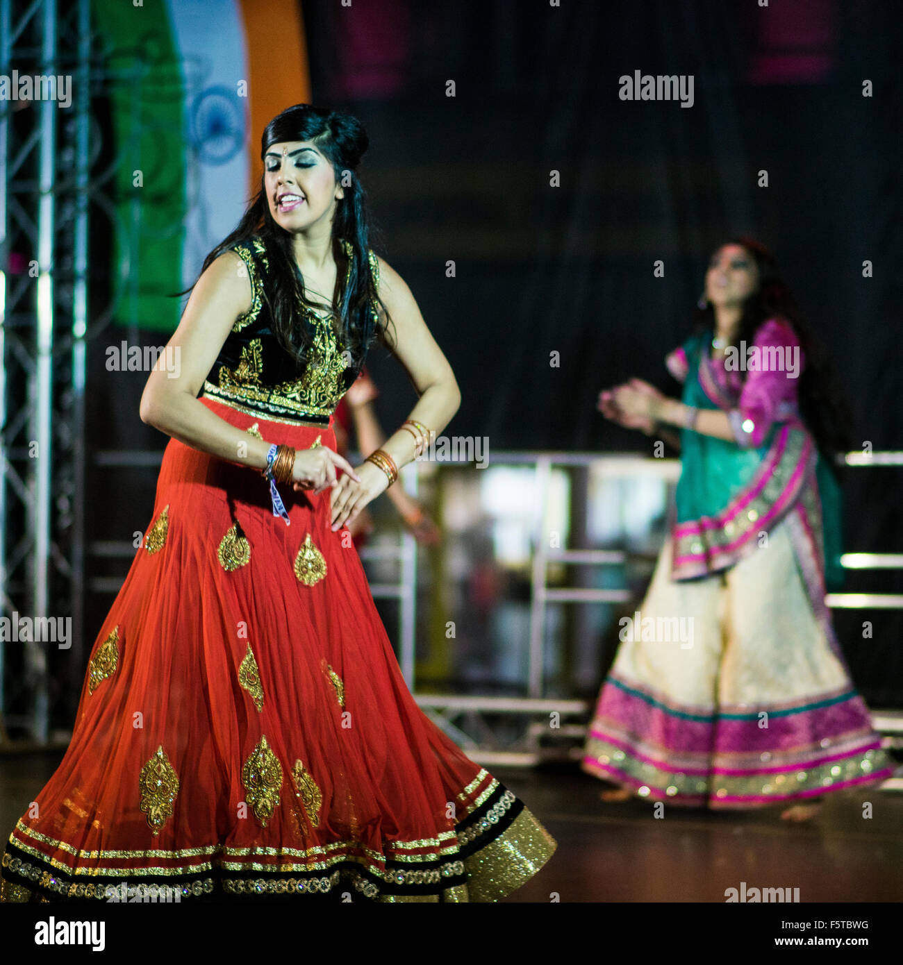 Indian dancers on stage wearing traditional costume Stock Photo - Alamy