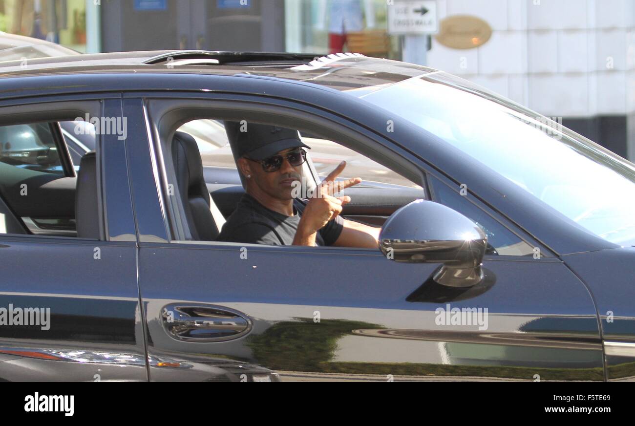 Criminal Minds star, Shemar Moore makes a hand gesture while driving ...