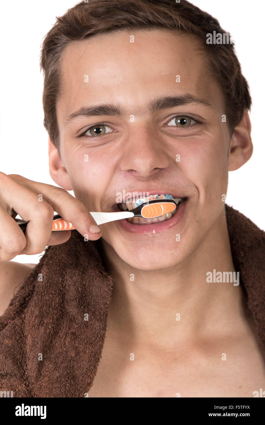 Teenage boy cleaning his teeth Stock Photo - Alamy