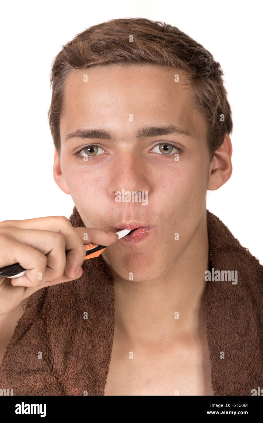 Teenage boy cleaning his teeth Stock Photo - Alamy