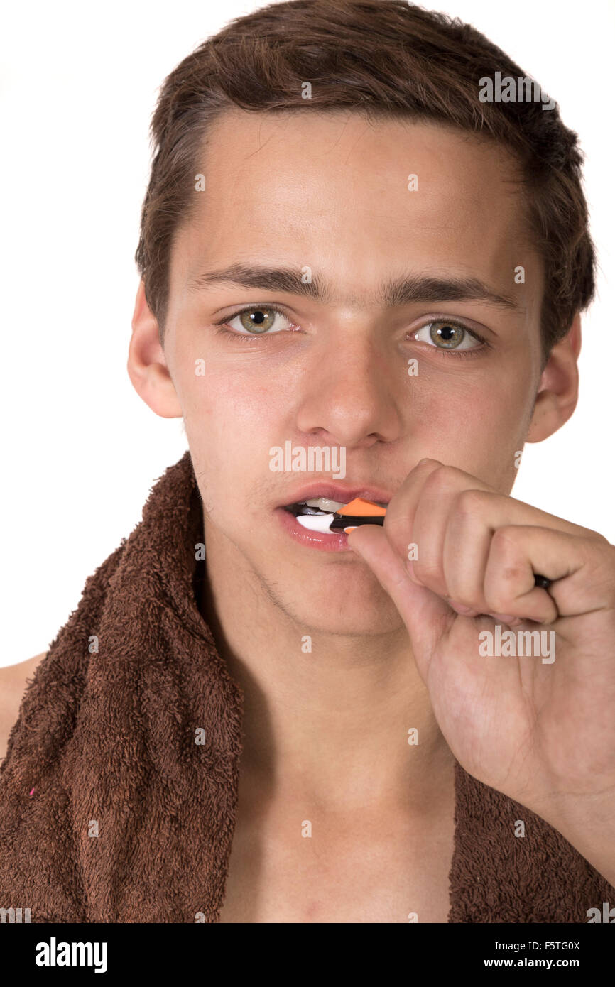 Teenage boy cleaning his teeth Stock Photo - Alamy