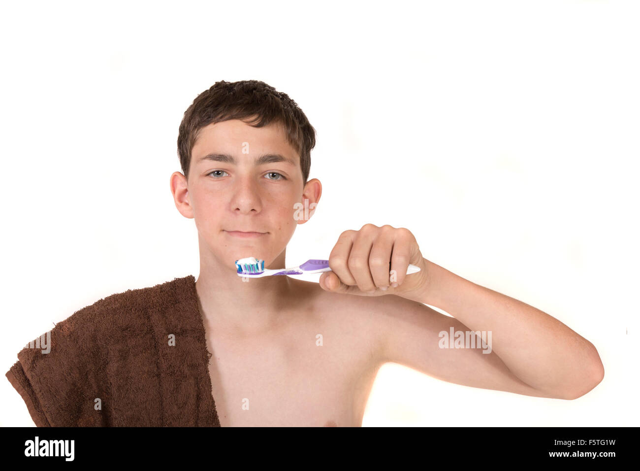 Teenage boy cleaning his teeth Stock Photo - Alamy