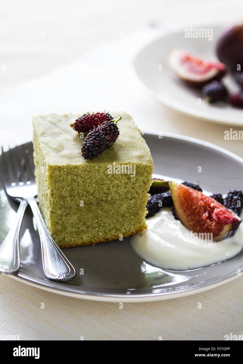 Matcha cake with Fig ,Mulberries and fresh cream Stock Photo - Alamy