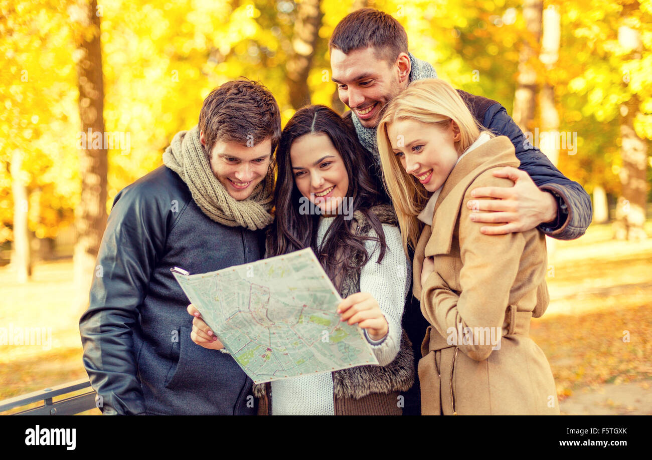 group of friends with map outdoors Stock Photo - Alamy