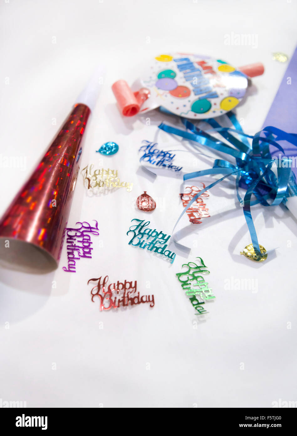 Colorful birthday celebration items Stock Photo - Alamy