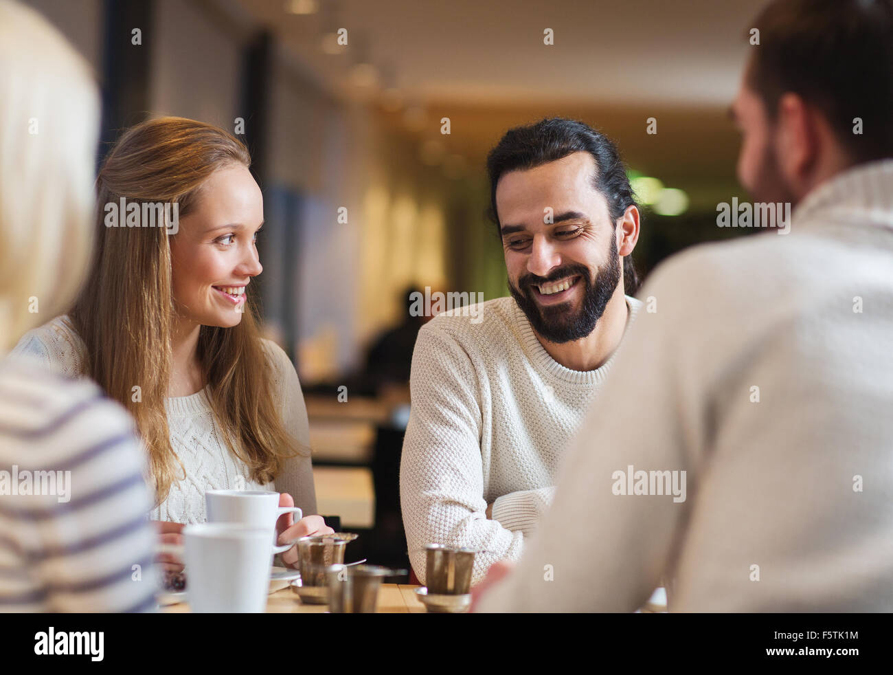 happy friends meeting and drinking tea or coffee Stock Photo - Alamy