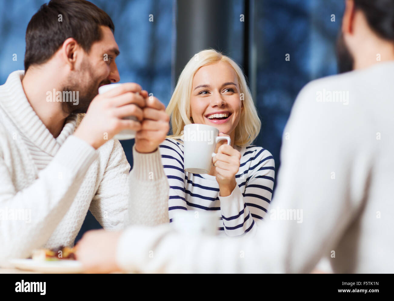 happy friends meeting and drinking tea or coffee Stock Photo - Alamy