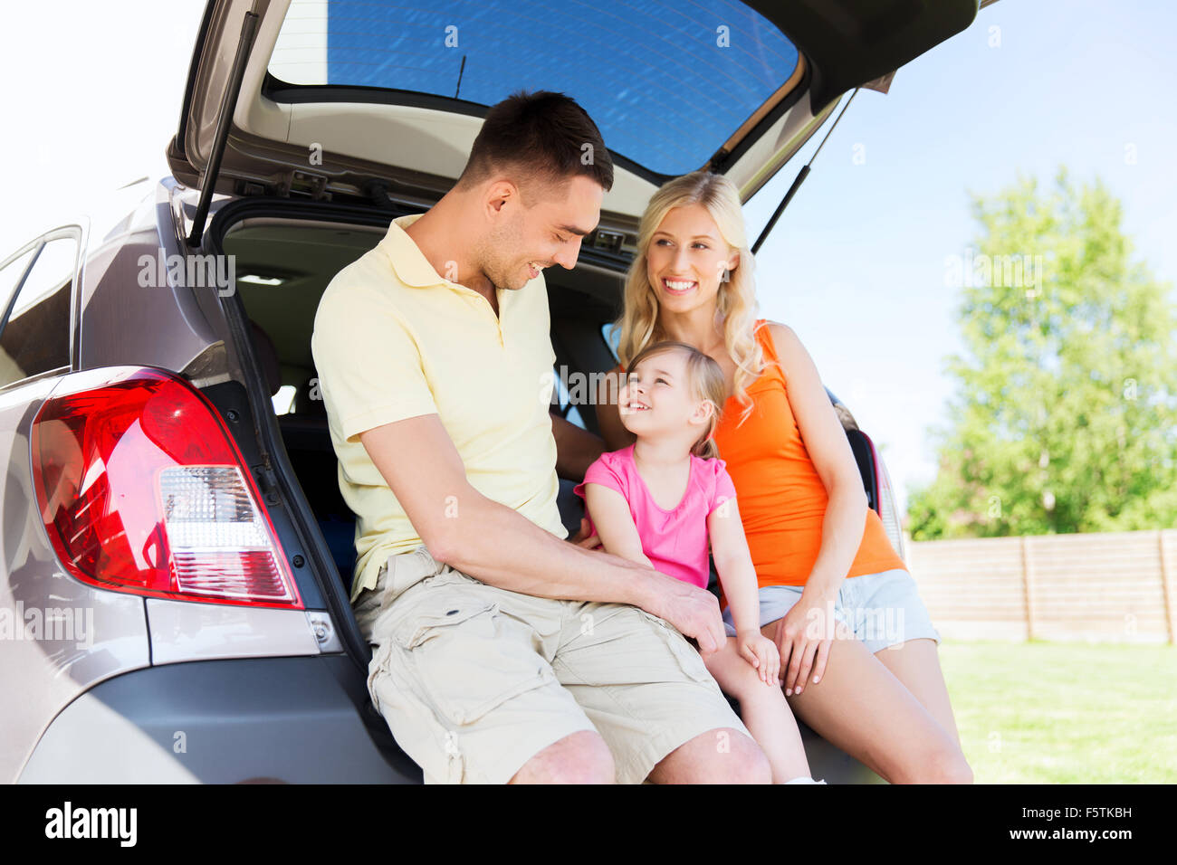happy family with hatchback car outdoors Stock Photo - Alamy