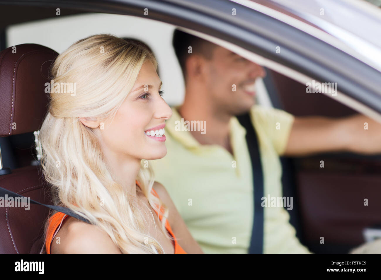 happy man and woman driving car Stock Photo - Alamy