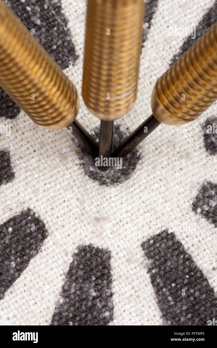 Three darts hitting the center of target Stock Photo - Alamy