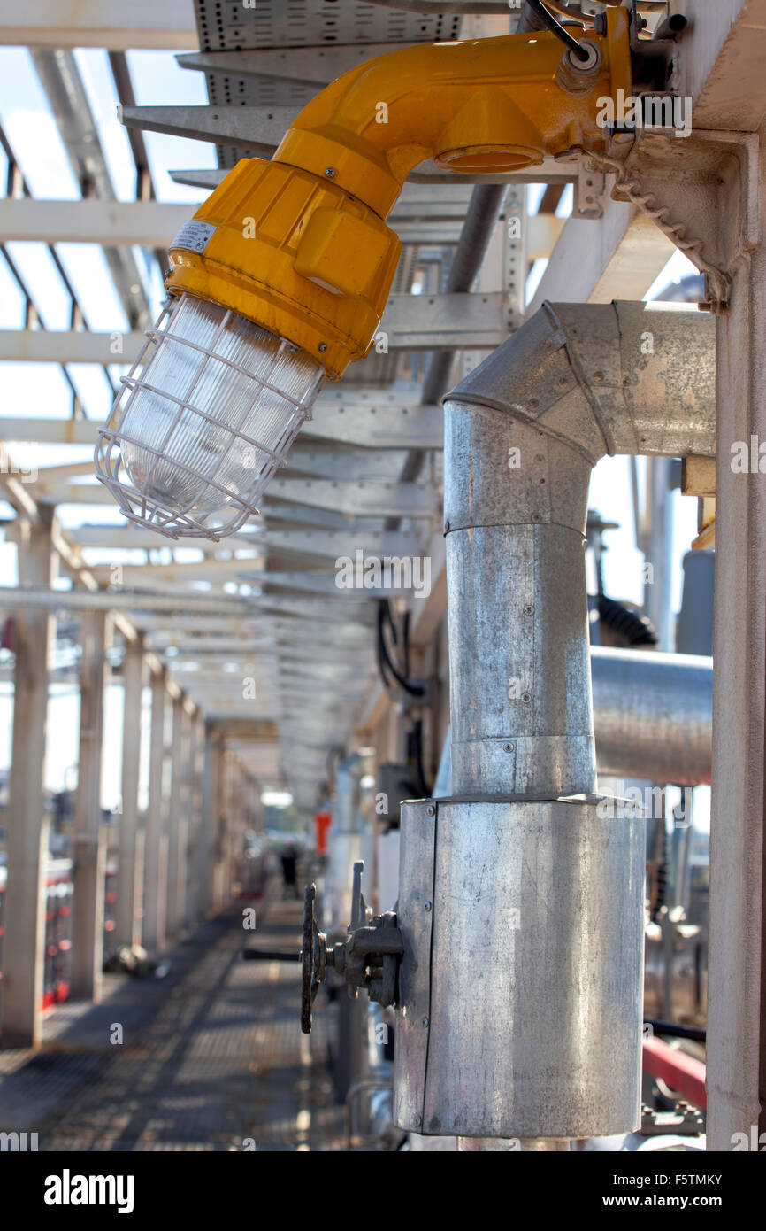 Steel pipes and industrial lamp Stock Photo - Alamy