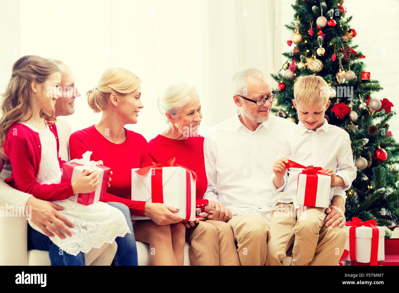 smiling family with gifts at home Stock Photo - Alamy