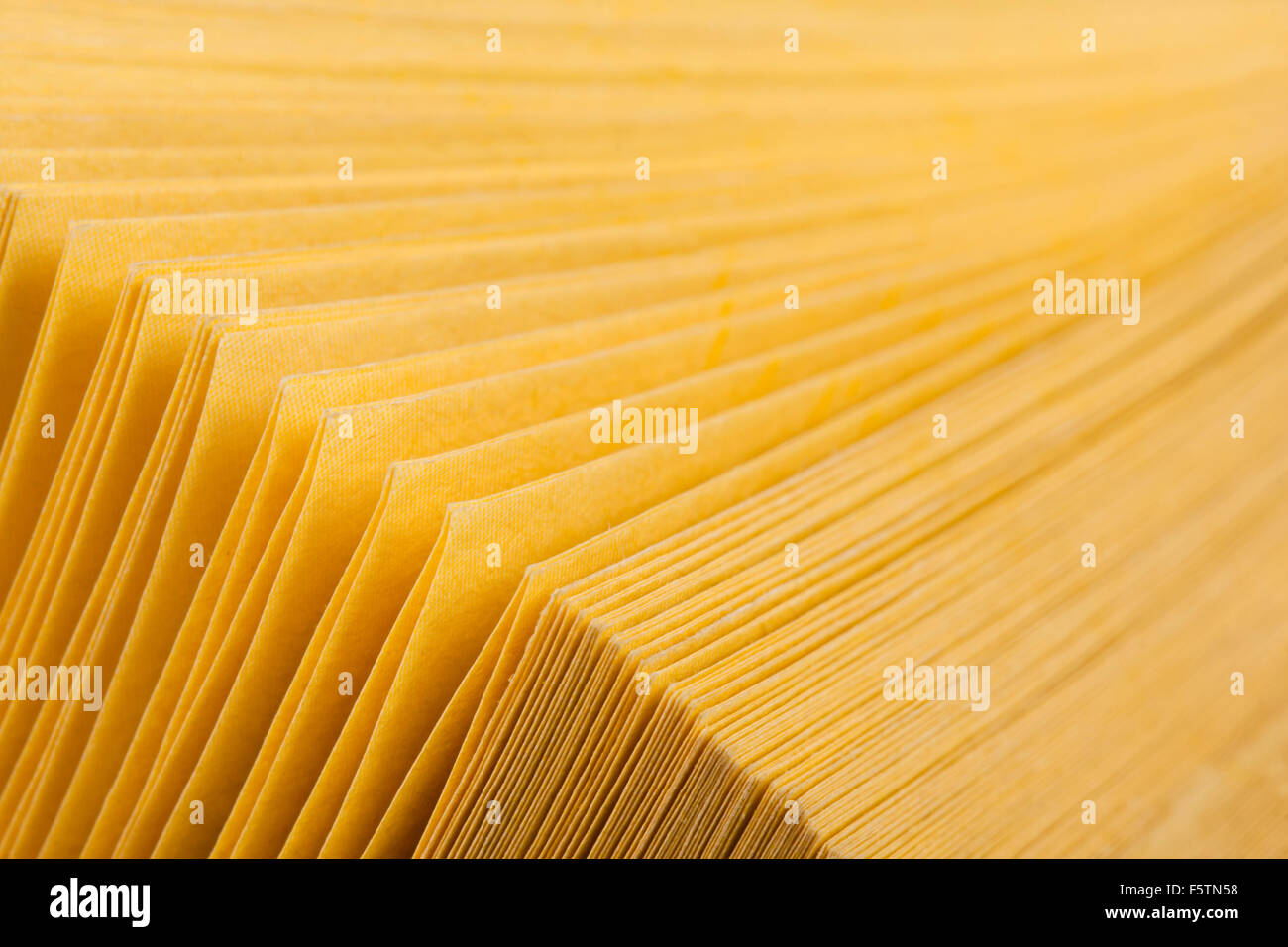 Close-up abstract view of yellow pages book Stock Photo - Alamy