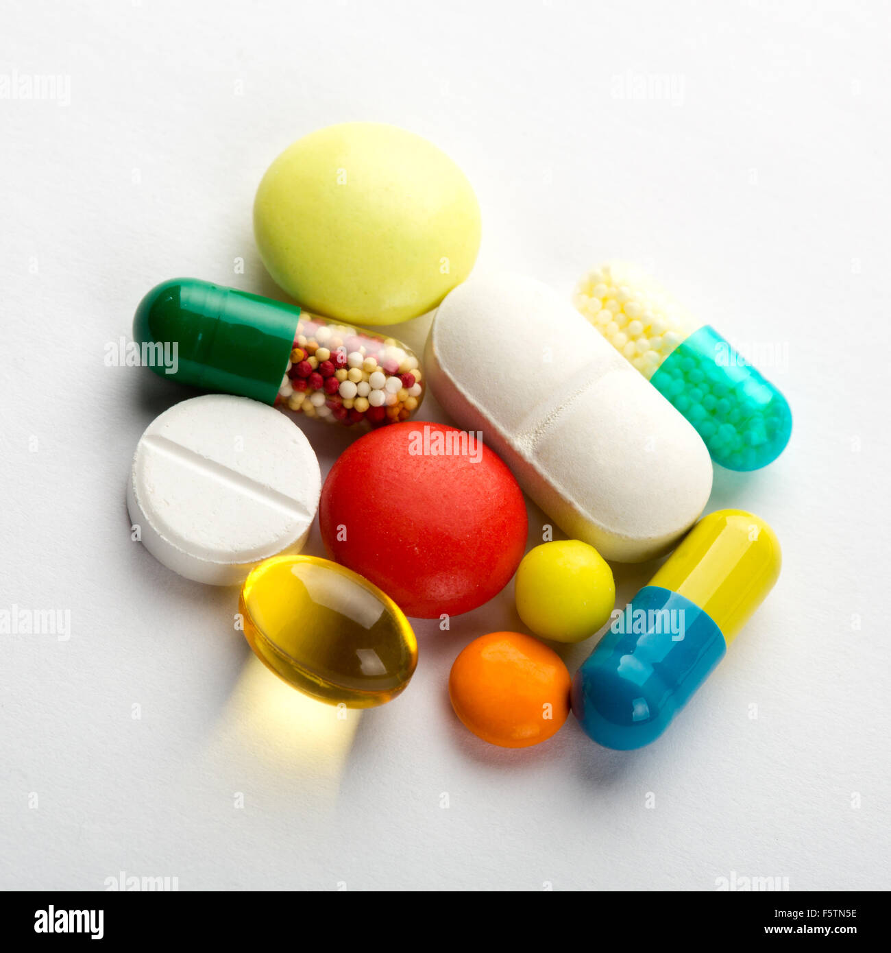 Set of different colorful pills Stock Photo - Alamy
