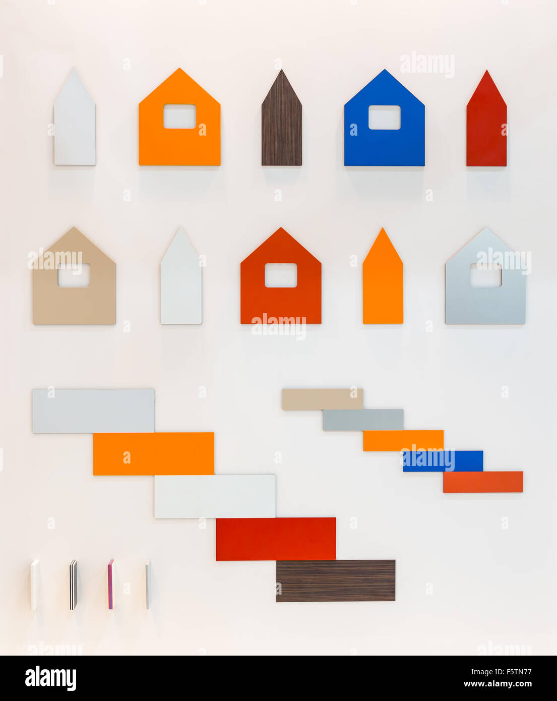 Cardboard patterns of multicolored buildings against white Stock Photo ...