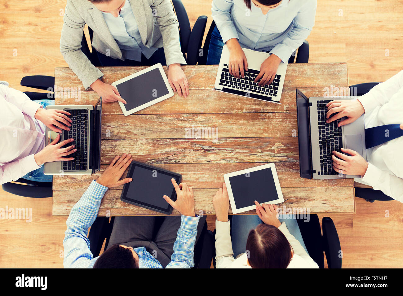 Laptop people team tablet hi-res stock photography and images - Alamy
