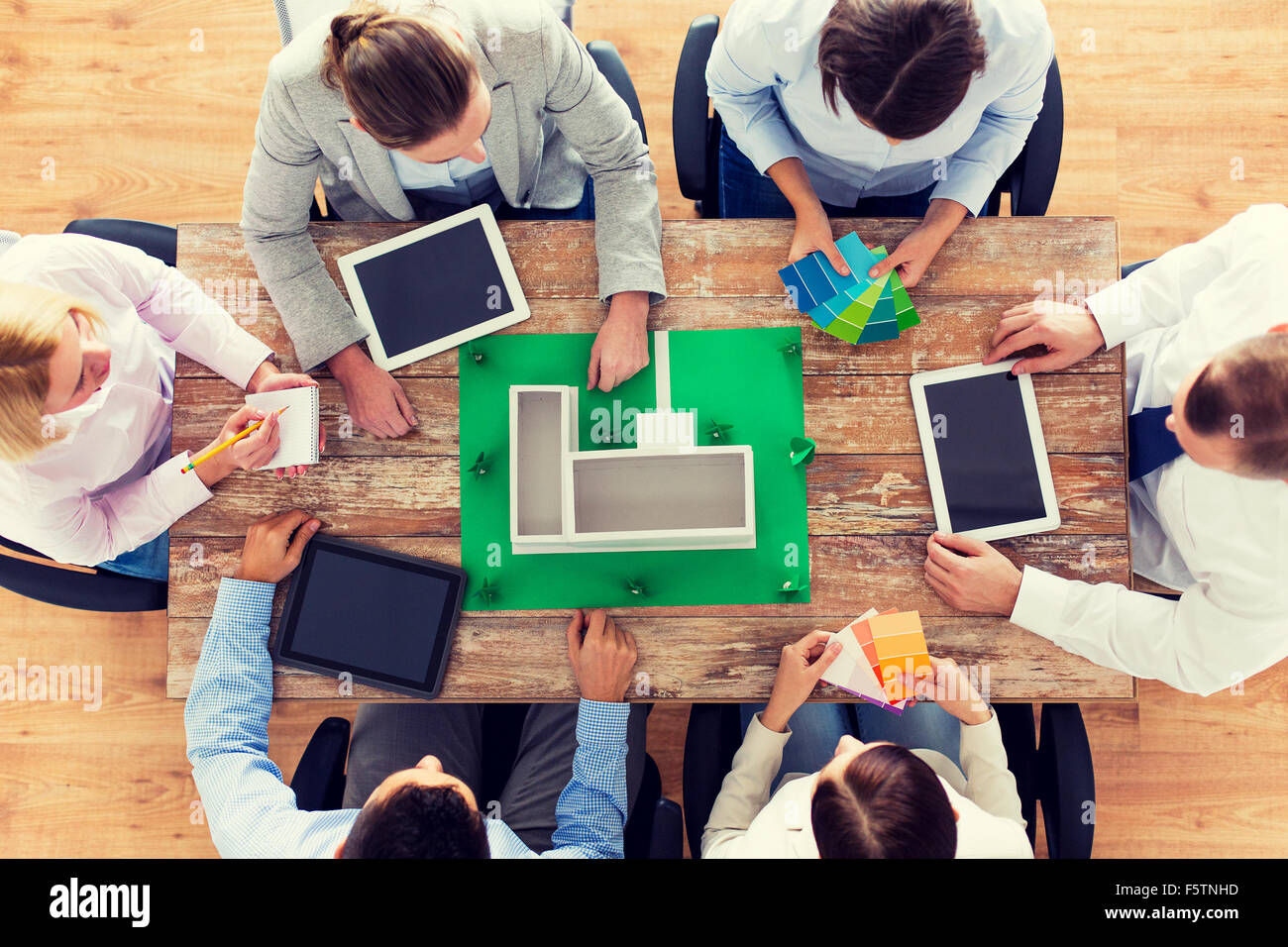 close up of business team with project layout Stock Photo - Alamy