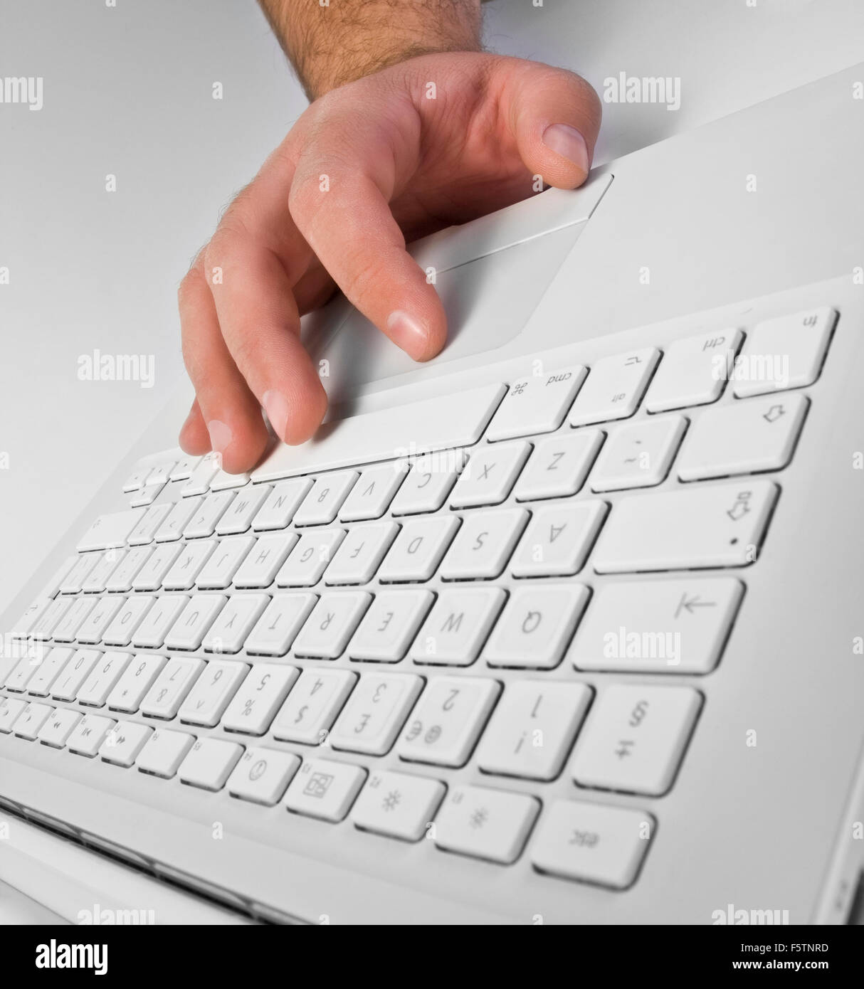 Man's hand on laptop Stock Photo - Alamy