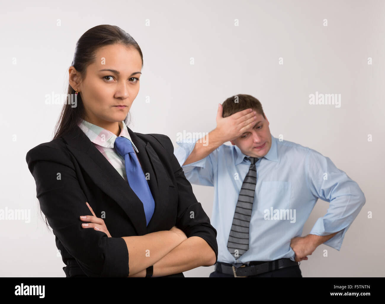 Two young caucasian office worker get mad Stock Photo - Alamy
