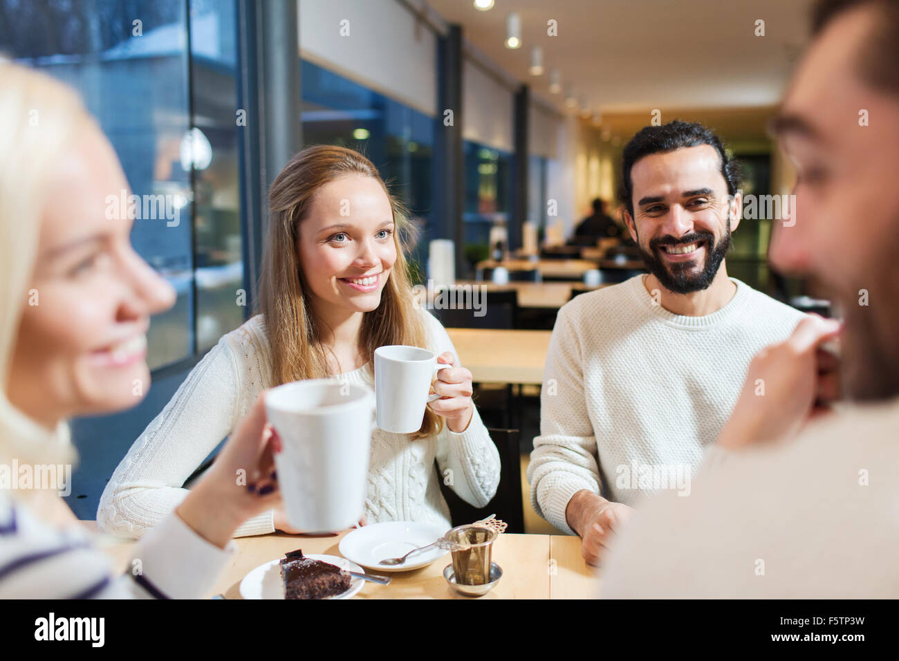 happy friends meeting and drinking tea or coffee Stock Photo - Alamy