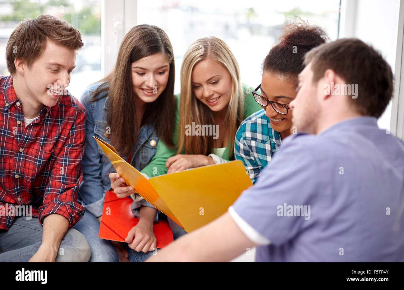 group of happy high school students or classmates Stock Photo - Alamy
