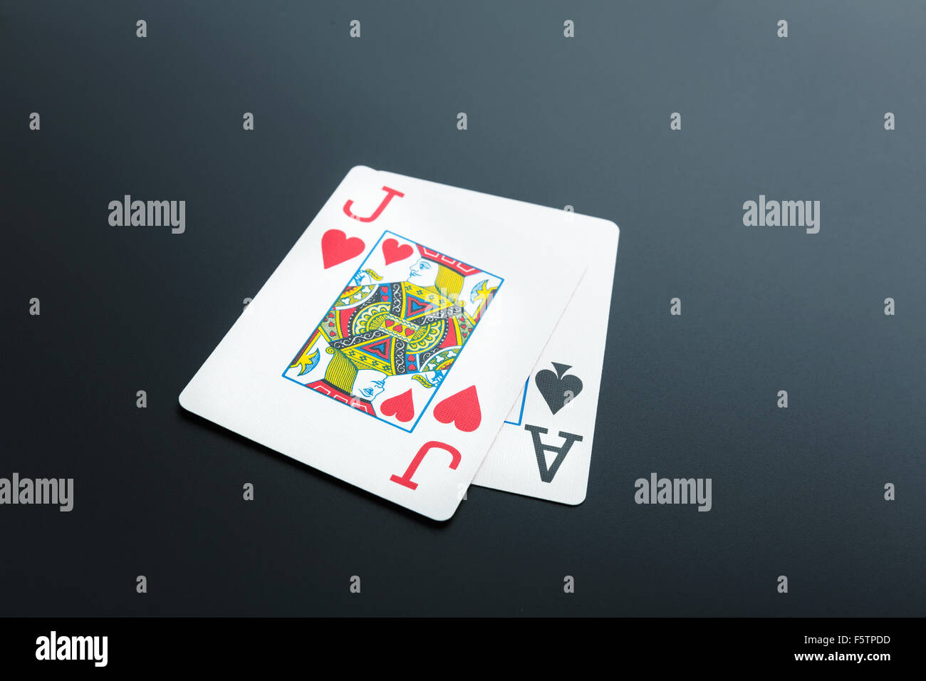 Black Jack. Two cards on grey background Stock Photo - Alamy