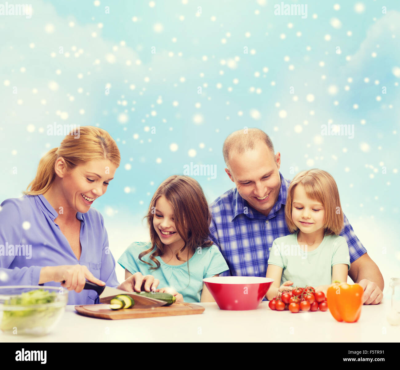 happy family with two kids making dinner at home Stock Photo - Alamy