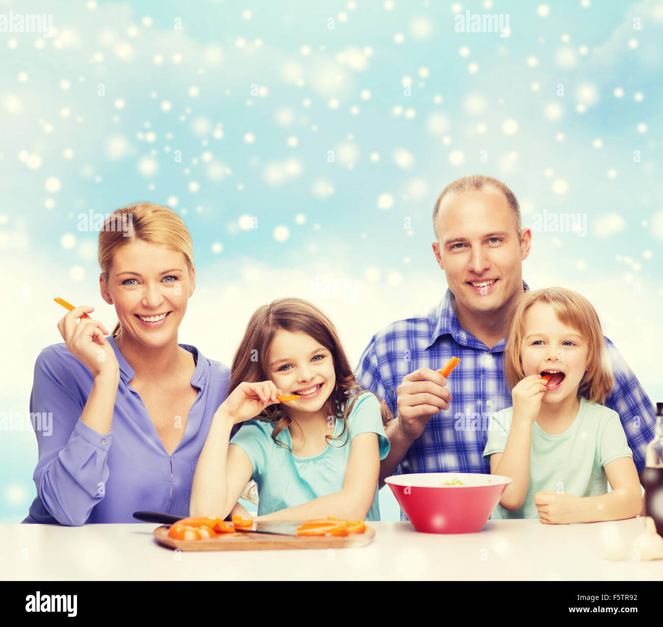 happy family with two kids making dinner at home Stock Photo - Alamy