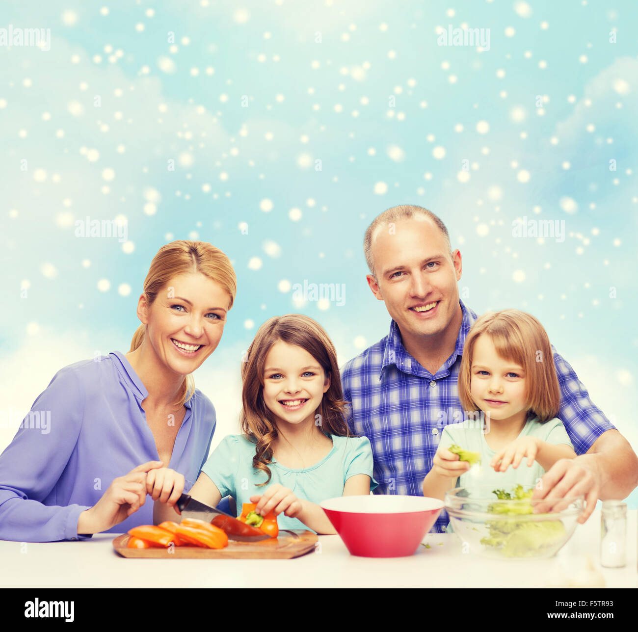 happy family with two kids making dinner at home Stock Photo - Alamy