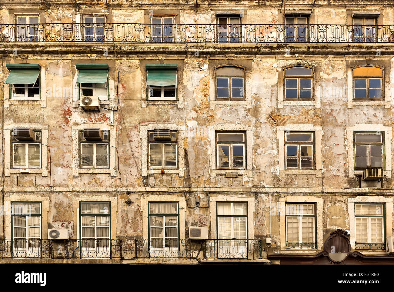 Old faded european house with wooden windows, Portugal Stock Photo - Alamy