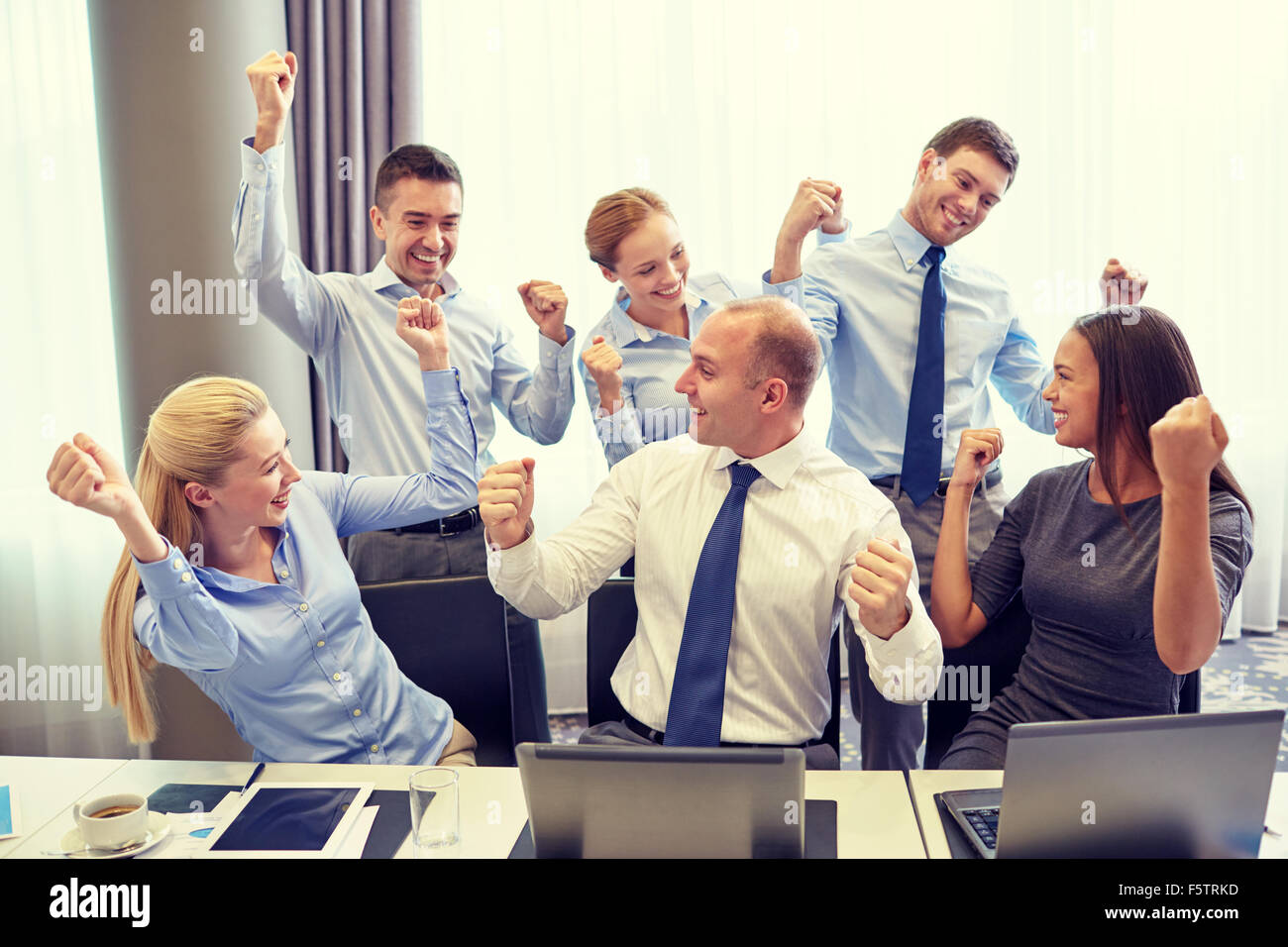 business people celebrating victory in office Stock Photo - Alamy