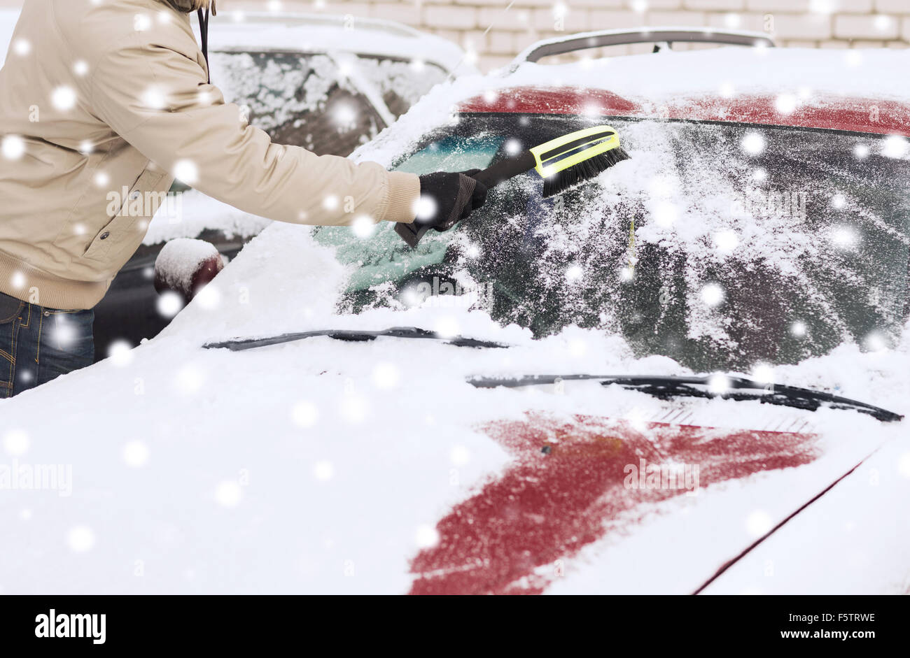 Person wiping snow from car hi-res stock photography and images - Alamy