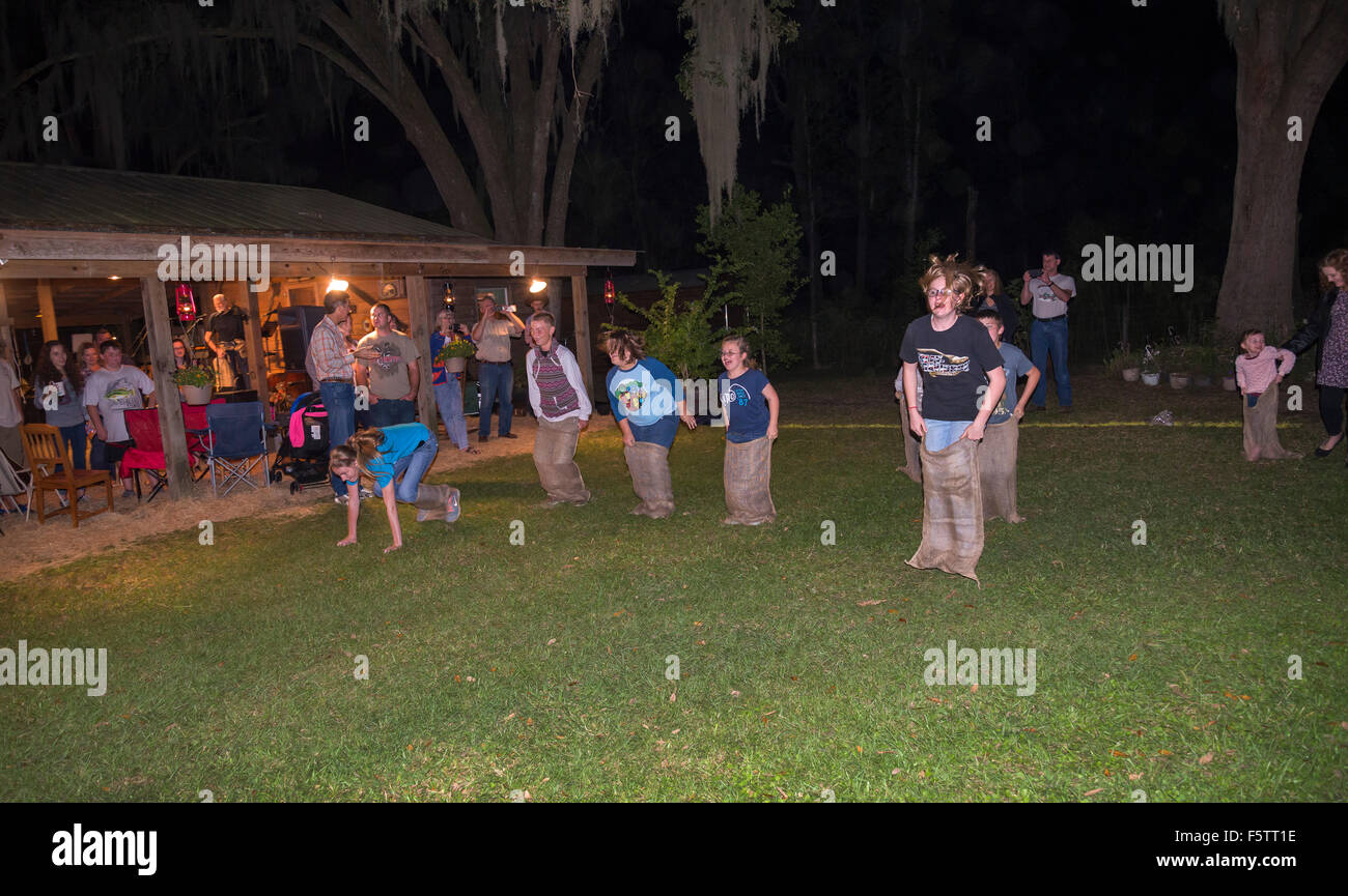 Kids in a sack race during a fall celebration in North Central Florida ...