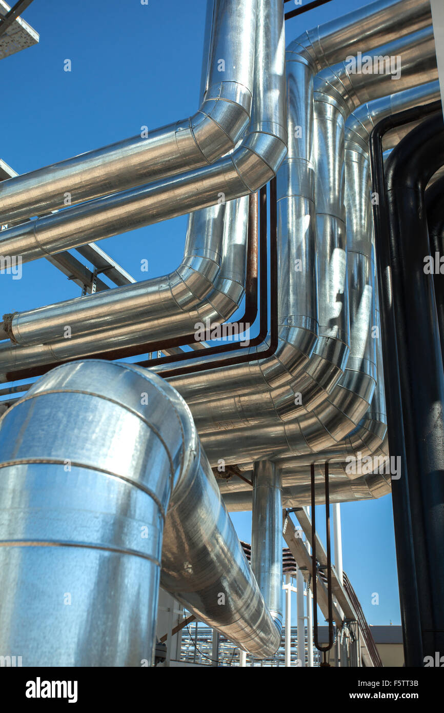 Industrial zone. Steel pipelines Stock Photo - Alamy