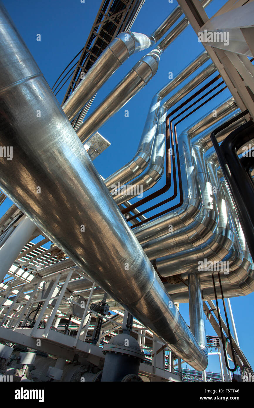 Industrial zone. Steel pipelines Stock Photo - Alamy