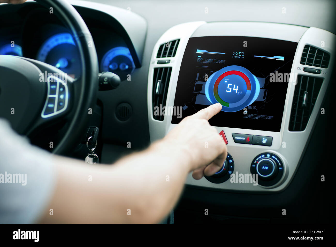 hand setting volume on car audio stereo system Stock Photo - Alamy