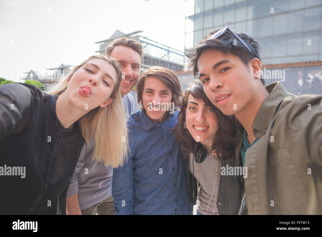 Group of young multiethnic friends having fun smiling and making ...