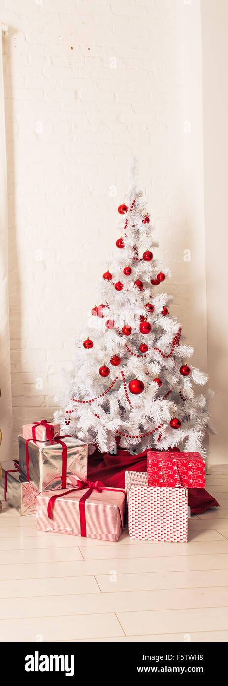 Christmas tree with many presents under it Stock Photo - Alamy