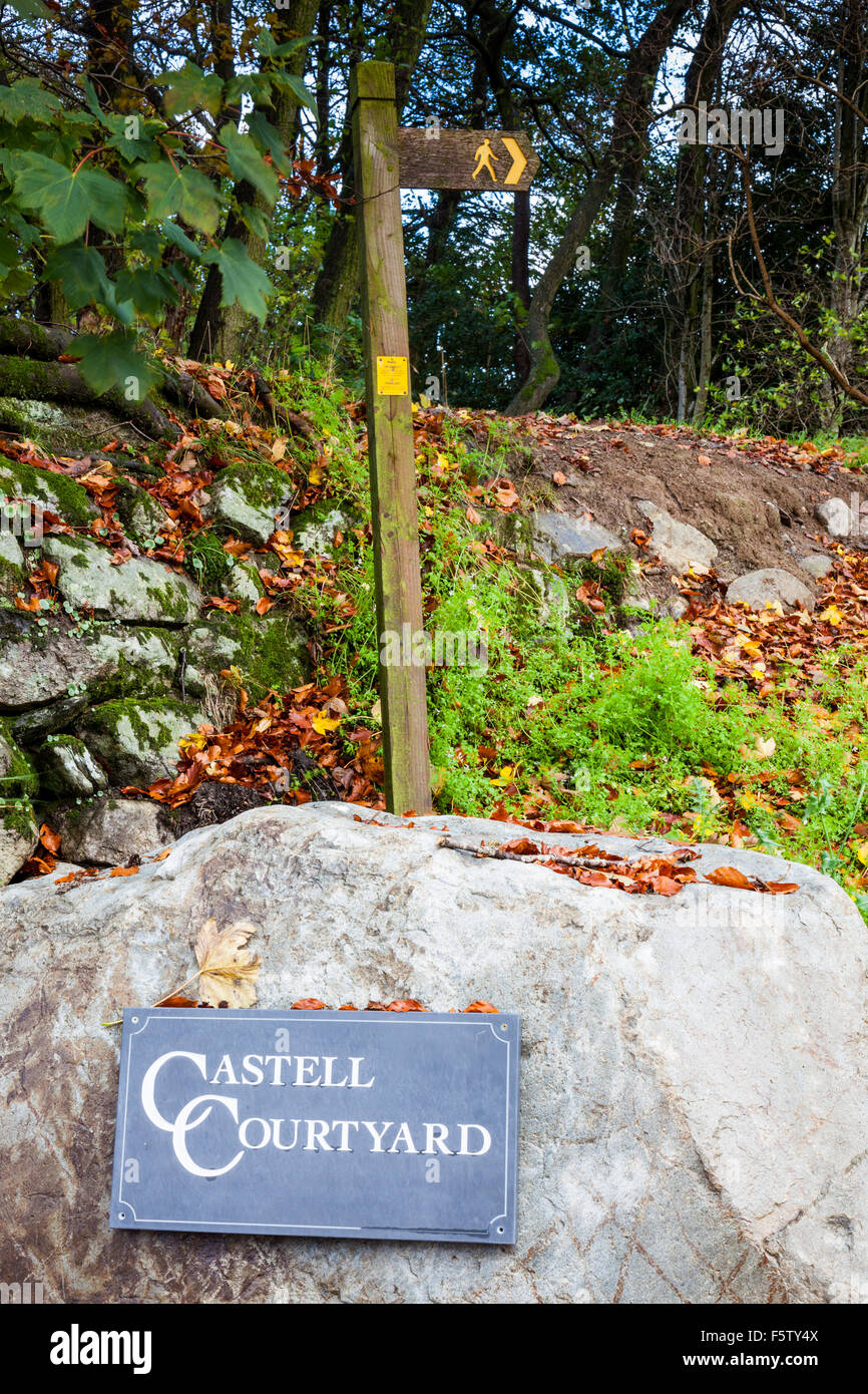 A footpath and Castell Courtyard sign, with autumnal leaves, near ...