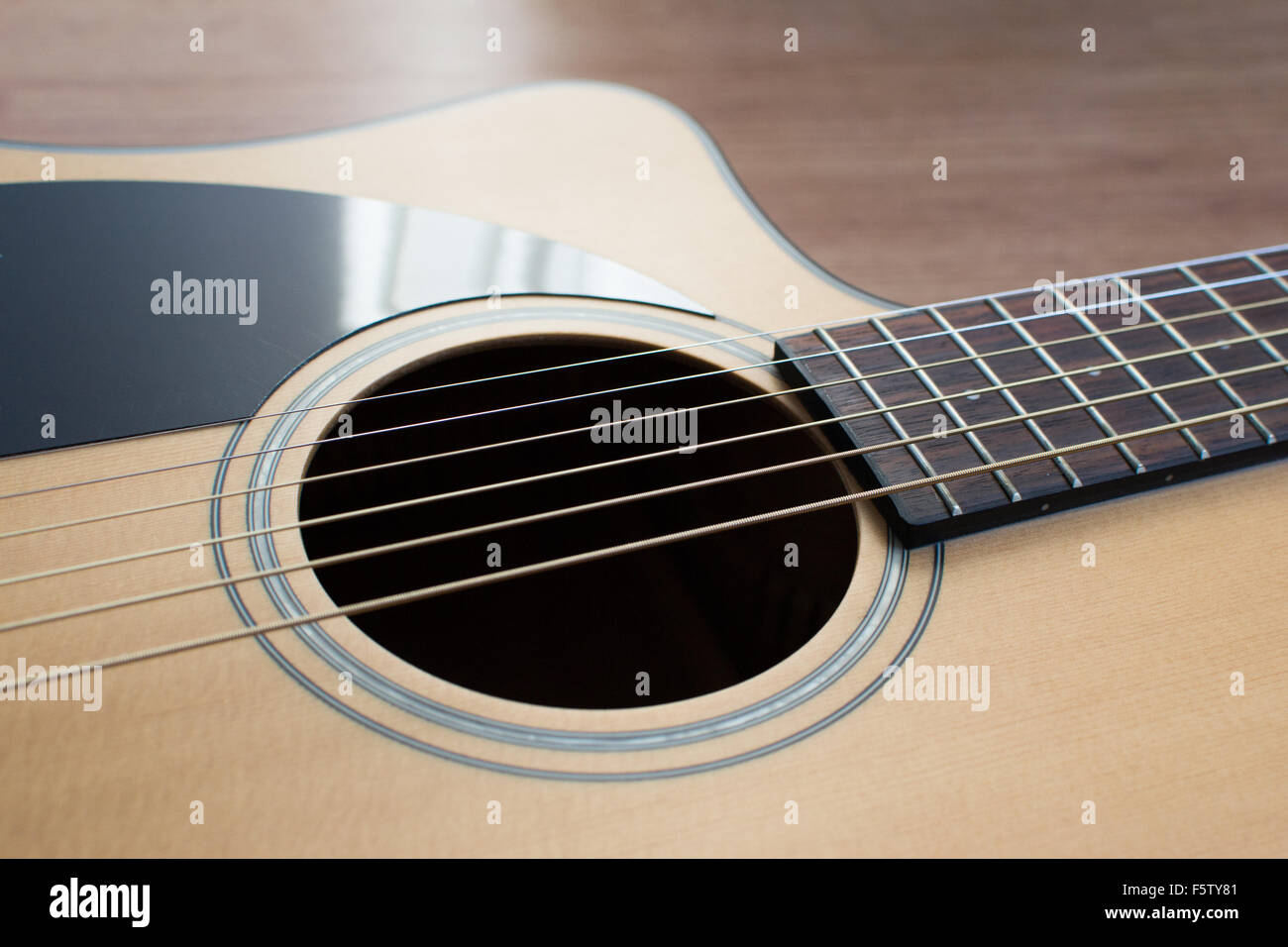 Close up of an acoustic guitar Stock Photo - Alamy