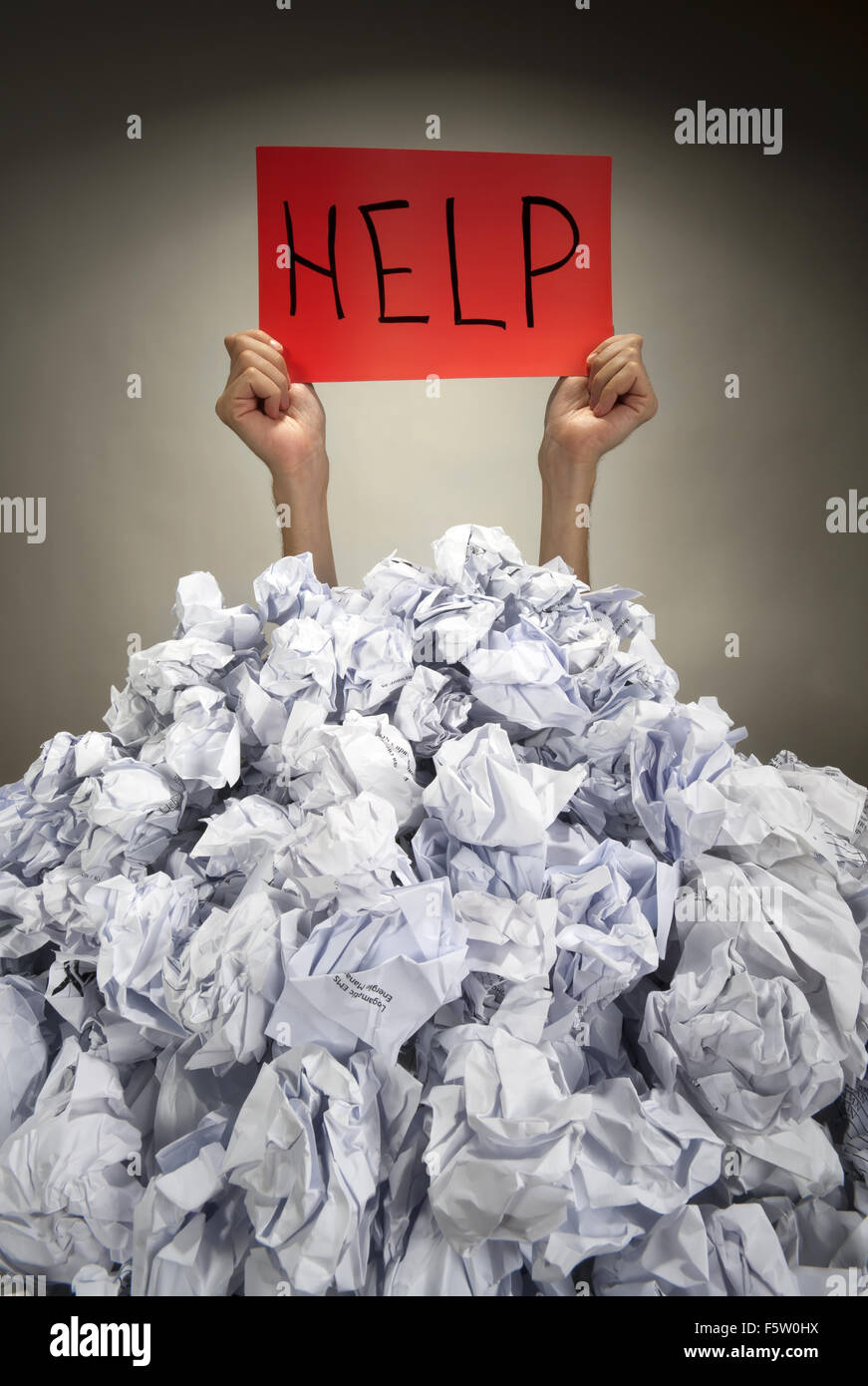 Hands with red frame reaches out from big heap of crumpled papers Stock ...